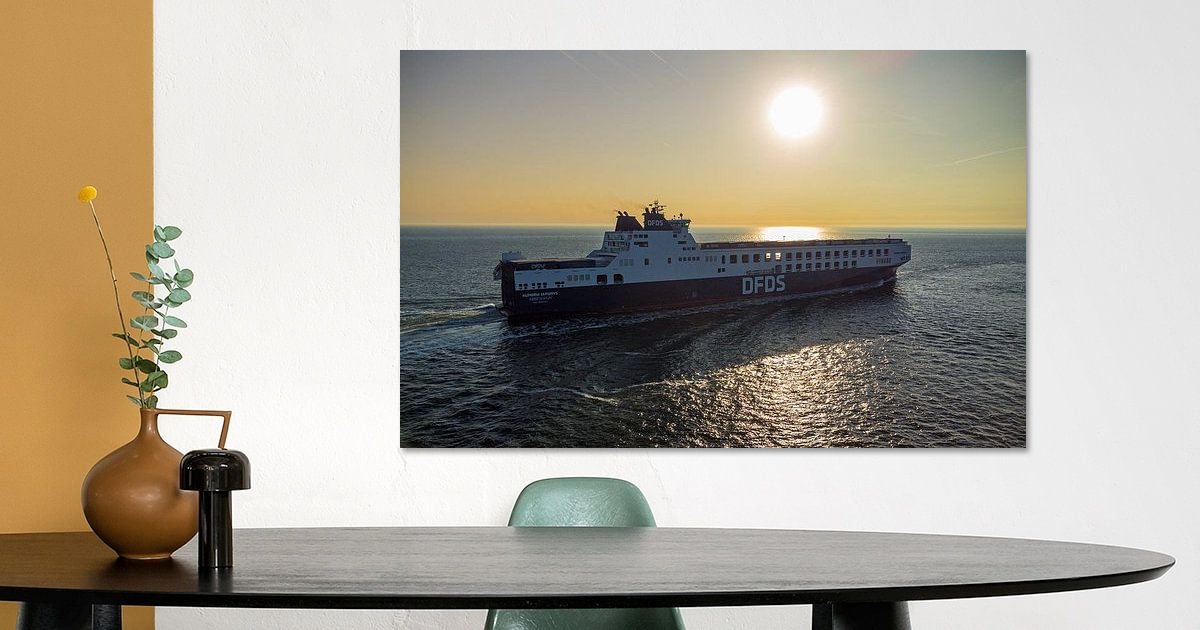 DFDS Ferry glides serenely over calm sea during fiery sunset: a magical ...