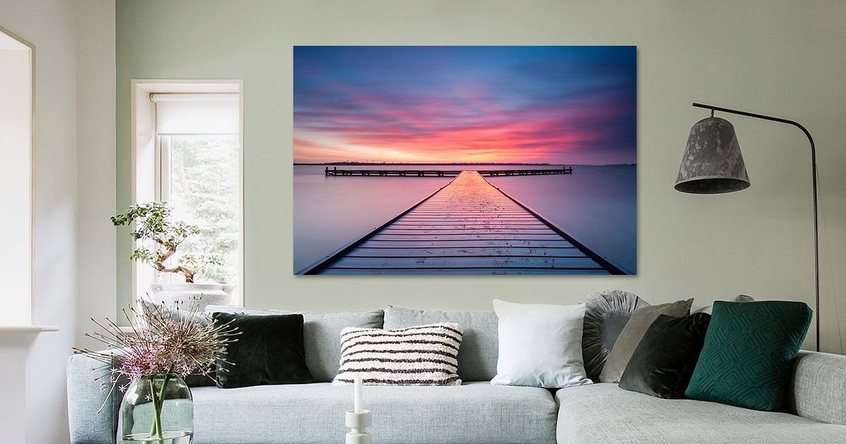 Zonsondergang bij steiger Vrouwenpolder Zeeland van Silvia Thiel op ...