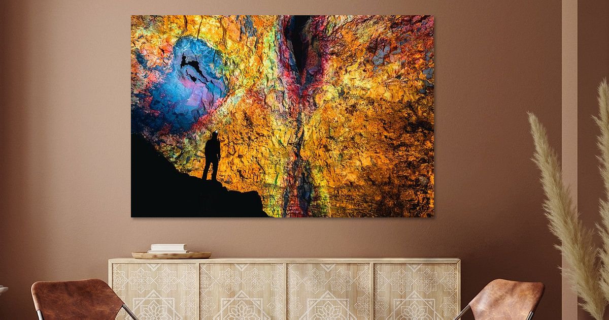 Man in a lava chamber / magma chamber of a volcano in Iceland by ...