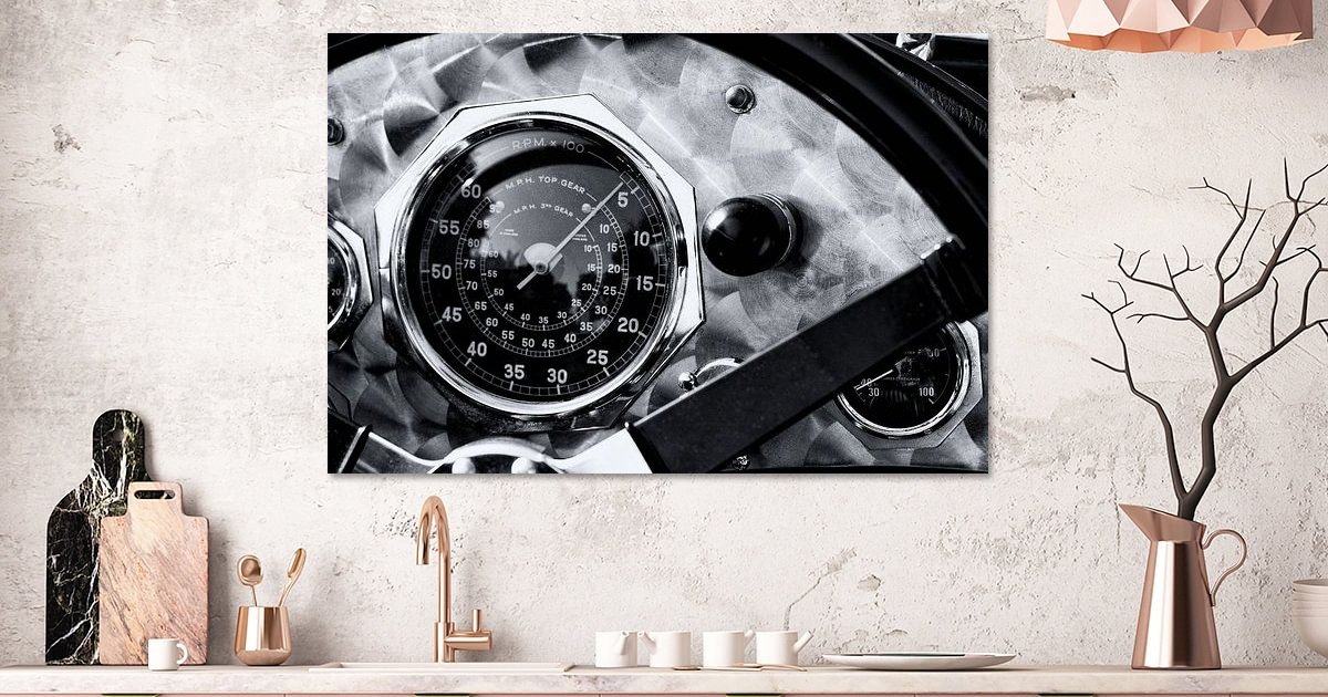 Brushed aluminium dashboard with speedometer on a vintage 1920s British ...