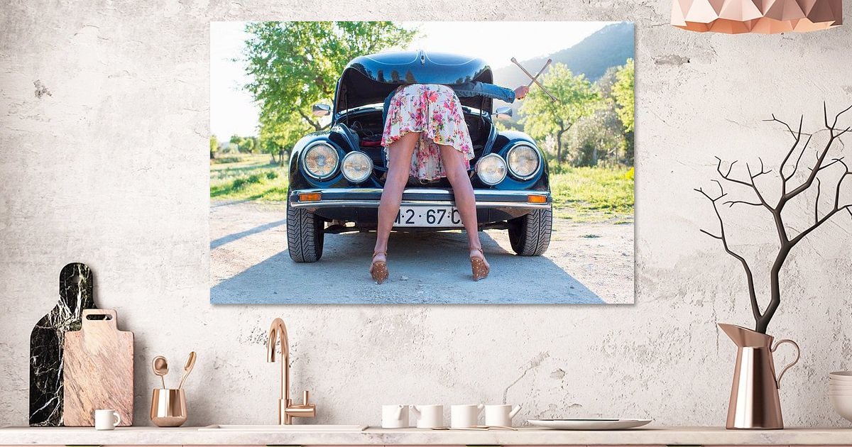SA11978877 Woman in dress bending over the bonnet of a car by ...